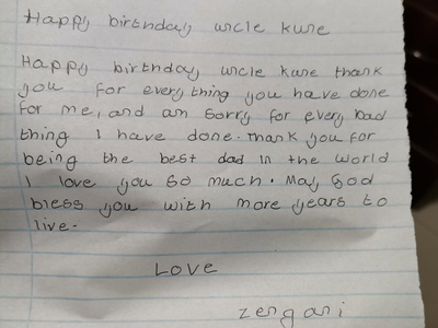 Little boy gives his neighbour a special Happy Birthday letter