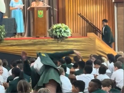 School girl falls at awards ceremony but motors through