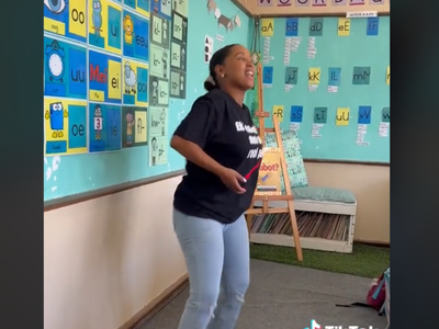 This awesome teacher dances whilst teaching phonetics to her class