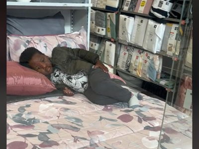 Kid rests on display bed after his tantrum