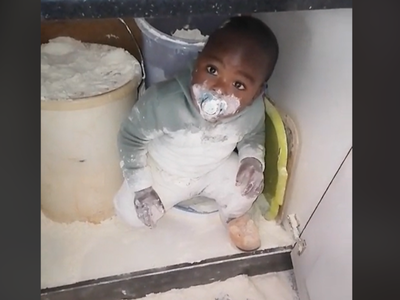 Toddler discovers the flour container