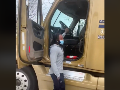 Truck driver parallel parks an 18-wheeler from outside the truck!