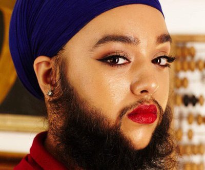 Youngest female with a full beard uses it to spread body positivity