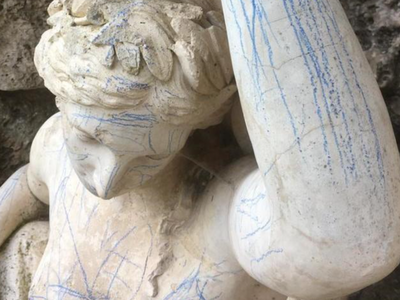 Statue defaced with bright blue crayon marking in UK