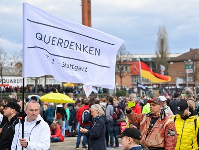 Germans protest in thousands against virus curbs
