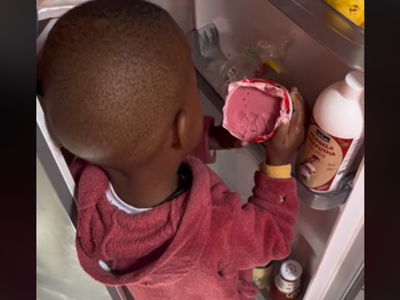 Little boy caught on camera sneaking in a snack