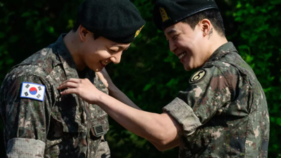 Two more BTS stars complete South Korea military duty