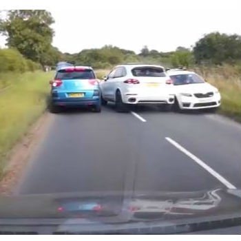 Porsche driver narrowly avoids causing a head-on crash