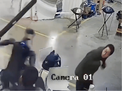 Robot violently attacks factory workers