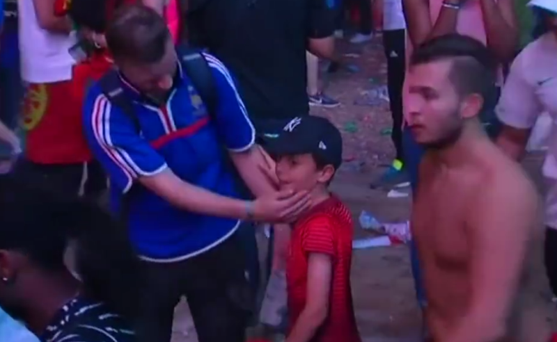 French fan consoled by a young Portuguese fan will melt you heart