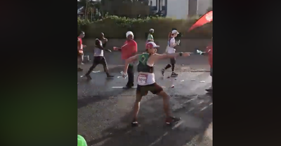 Marathon runner breaks it down at Comrades water point