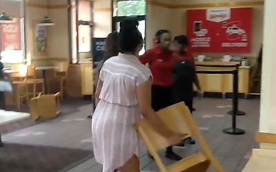 Chairs fly in intense fight between a man and two women