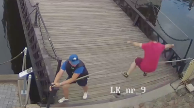 Man lands face first after jumping onto bridge