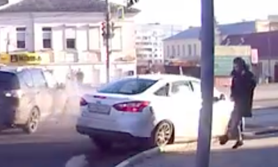 VIDEO: Horrific moment two cars collide and almost hit pedestrian