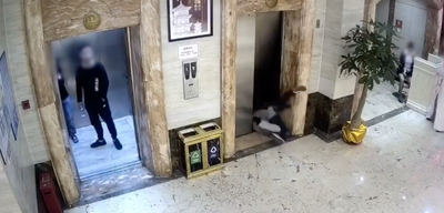 Shocking moment drunk duo falls down elevator shaft