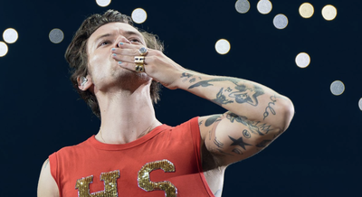 Harry Styles hit in eye with item thrown on stage during concert
