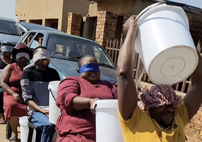 WATCH: Hilarious and wholesome family moment of passing water buckets ...