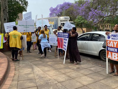 Protest outside Pinetown court as double murder accused cop appears