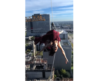 Woman dangles from 17th floor in aerial dancing stunt