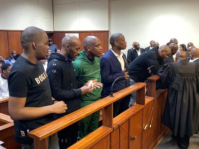 Seven accused in AKA murder trial appear together as case postponed to ...
