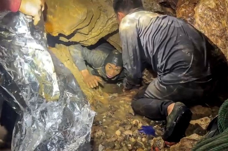 Rescuers seek new route to two missing in Laos cave