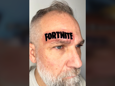 Another forehead tattoo! Dad loses bet and gets this Fortnite tat