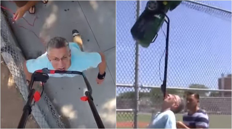 Man balances lawnmower on chin, breaks world record