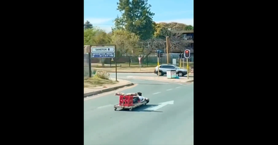 WATCH: Man rides trolley down hill in Sandton and skips a red light