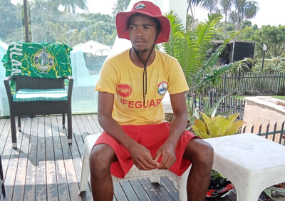 Who is the local lifeguard who saved two lives at Umhlanga Beach?