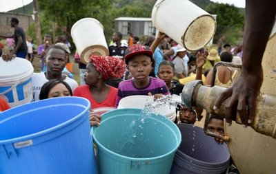 Residents queue for water