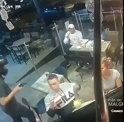 WATCH: Robber caught on camera as man enjoys his chicken wings